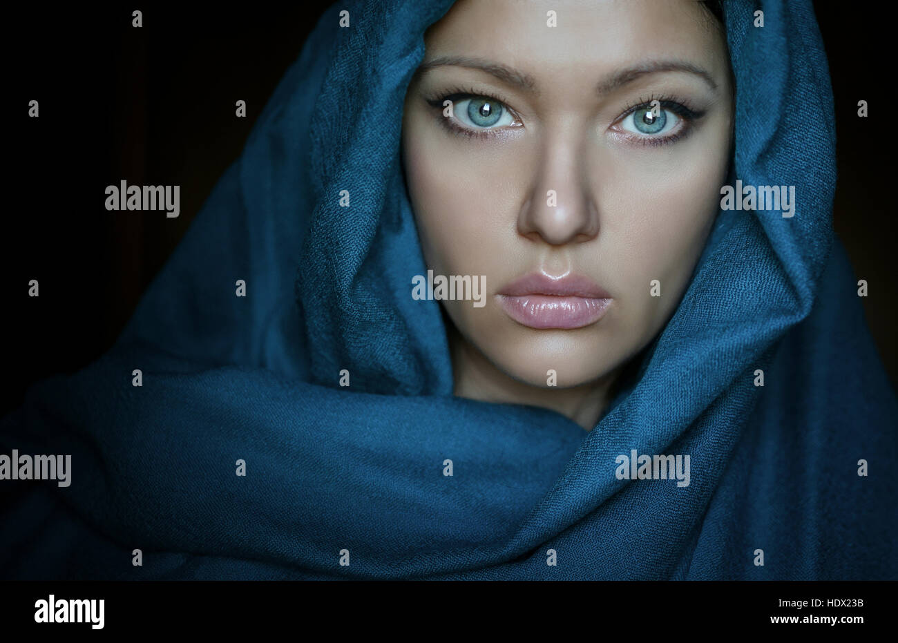 Caucasian woman wearing blue headscarf Stock Photo - Alamy