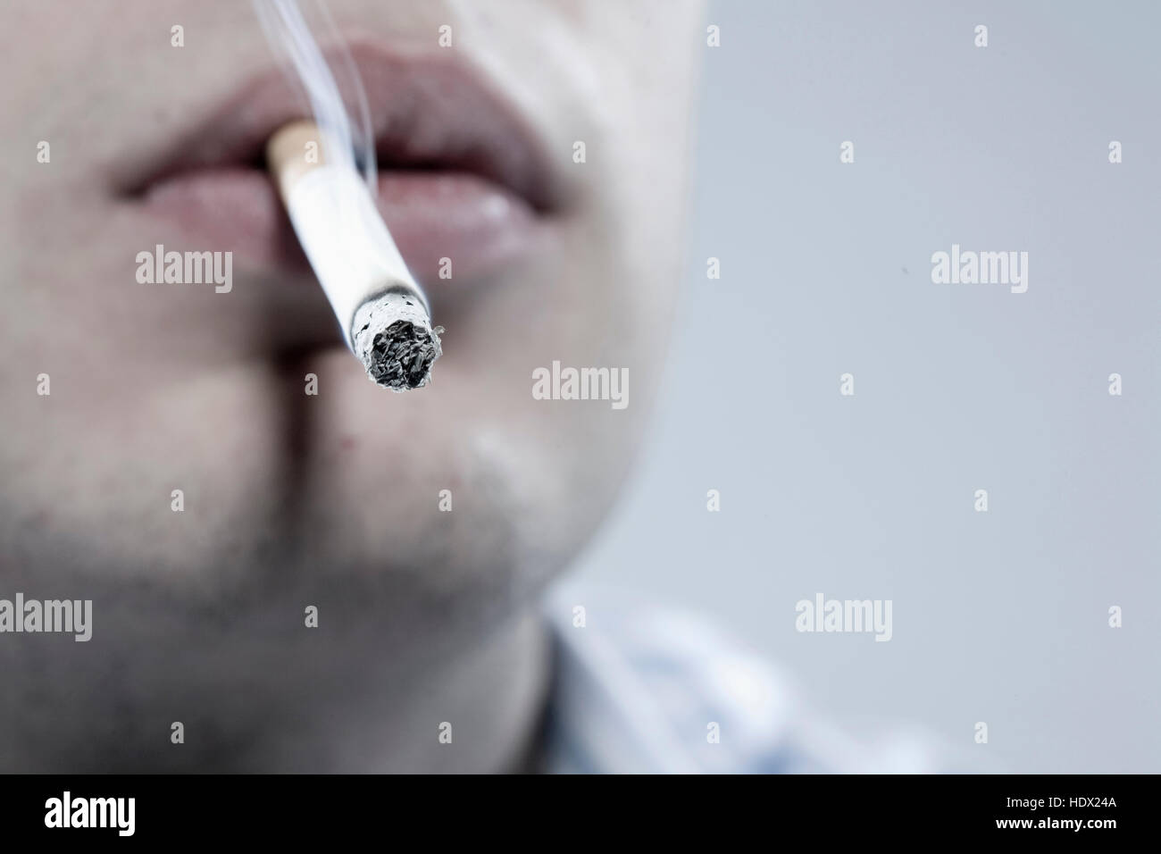 Caucasian man smoking cigarette Stock Photo - Alamy