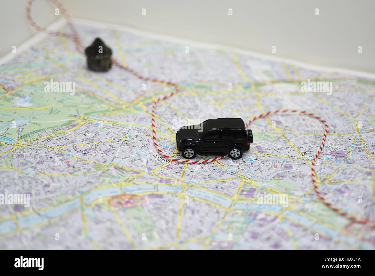 Abstract idea of rent a car. Small car on map Stock Photo - Alamy