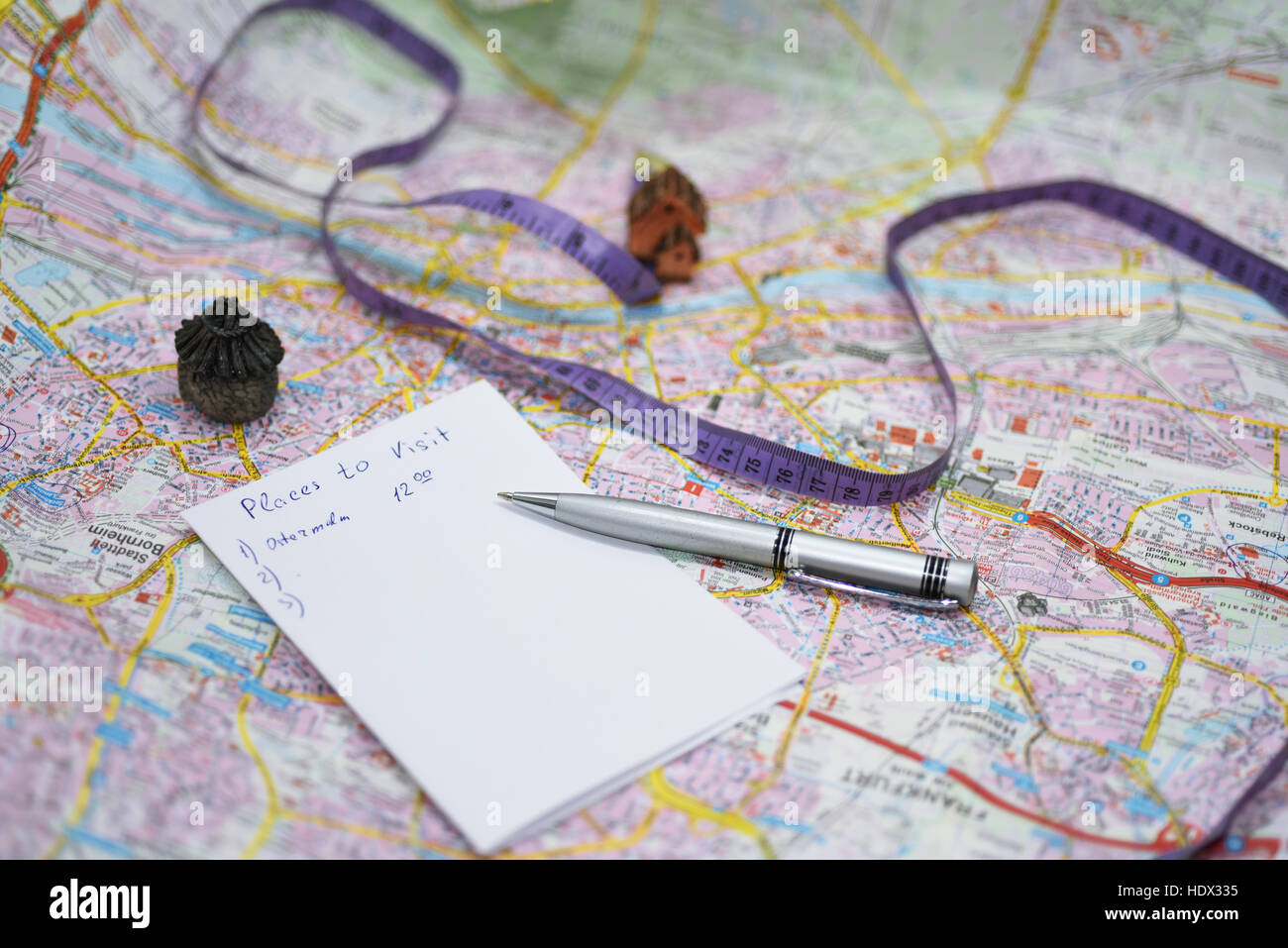 Planning route of city visiting. Big map on table with equipment Stock ...