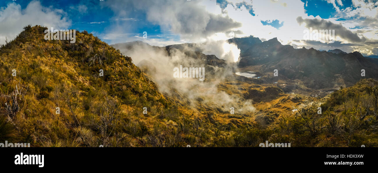 Panoramic photo of wilderness in mountains covered by fog in Trikora ...