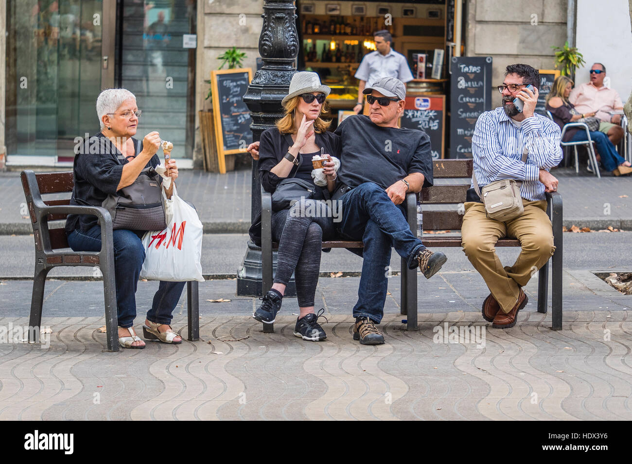 People seating on a bench hi-res stock photography and images - Alamy
