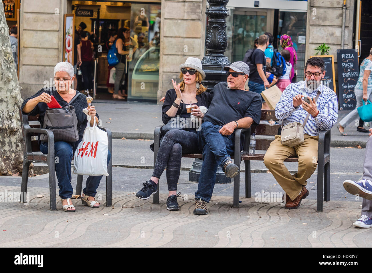 People seating on a bench hi-res stock photography and images - Alamy