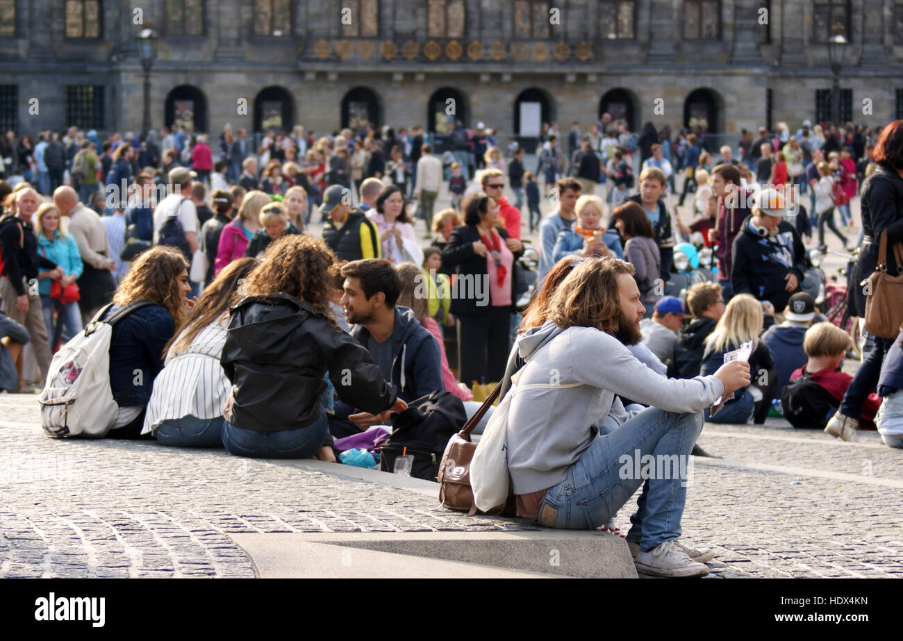 People sitting standing hi-res stock photography and images - Alamy