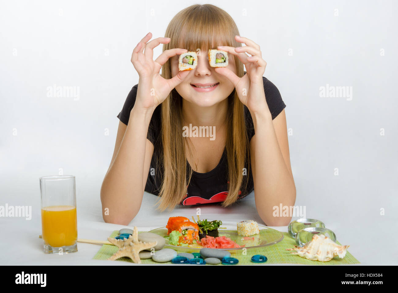 Young girl put roll your eyes and with a smile looks in the frame Stock ...