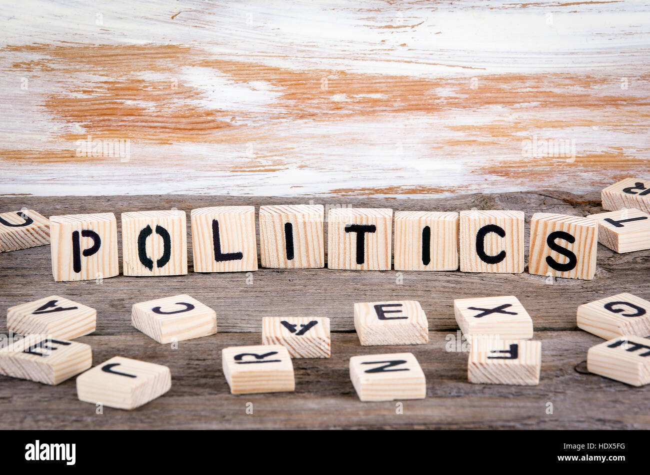 Politics from wooden letterson on wooden background Stock Photo - Alamy