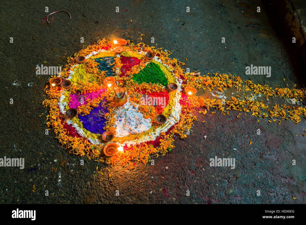 A colorful mandala is made from colorpowder and candles for the Tihar ...