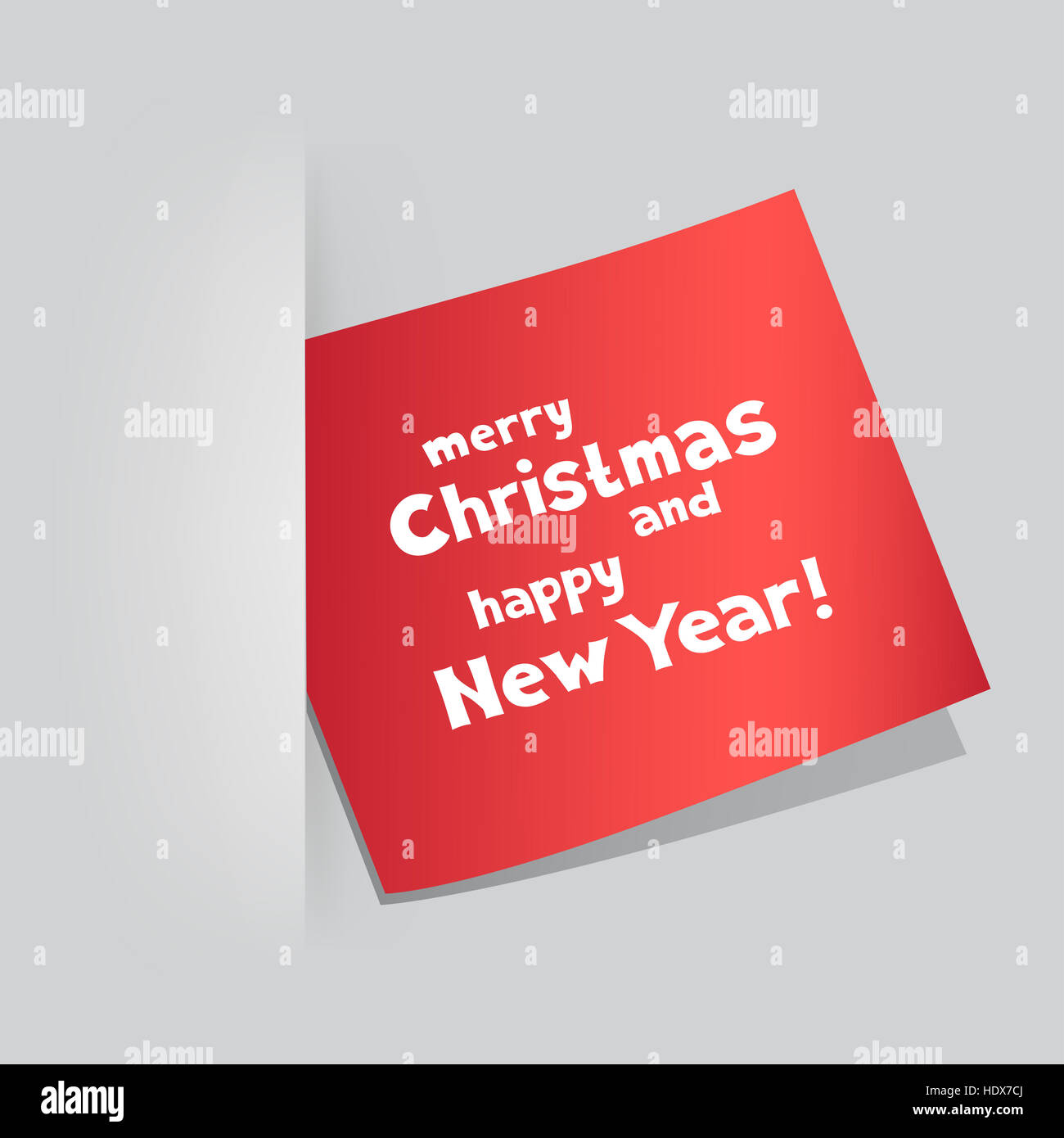 The colored red piece of paper with the message of Christmas greetings ...