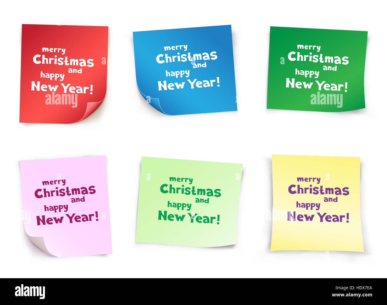 The colored pieces of paper with the message of Christmas greetings on ...