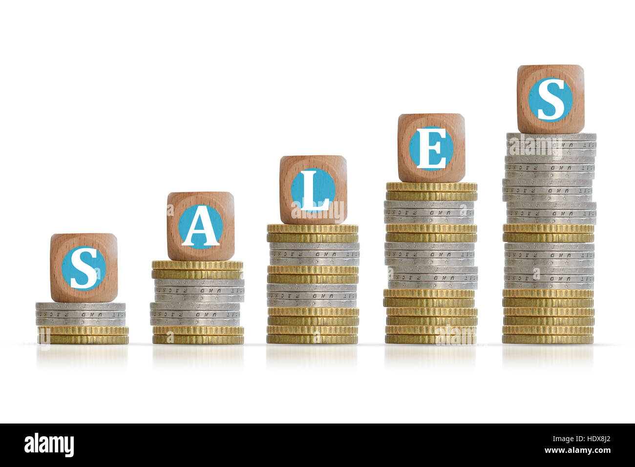 Increase sales concept with pile of coins isolated on white background ...