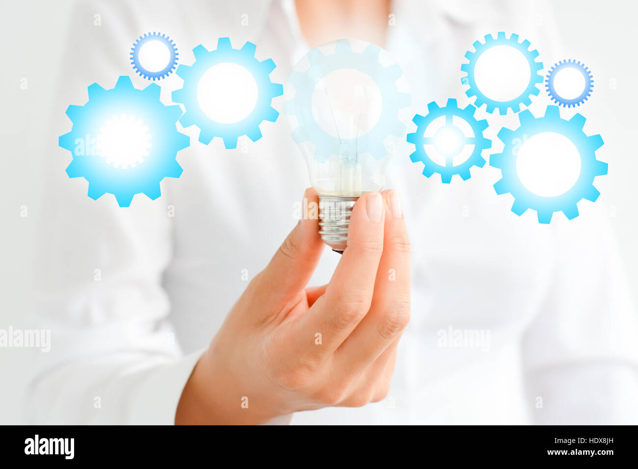 Business innovation concept with light bulbs and spinning gears Stock ...