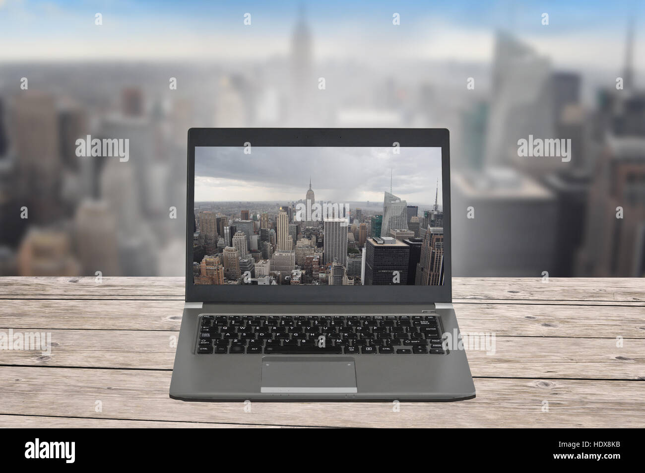 Laptop computer with New York skyline Stock Photo - Alamy