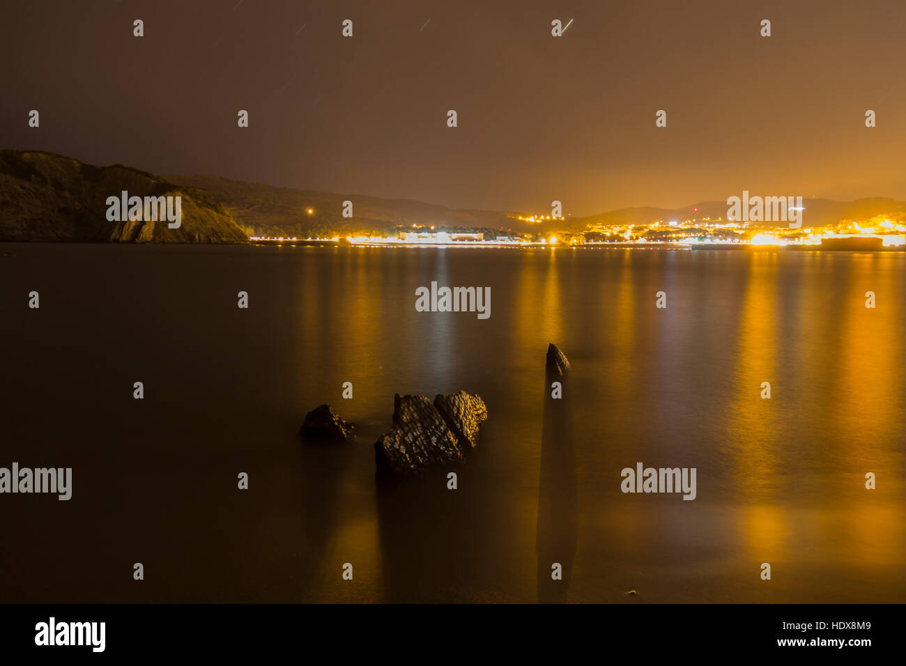 rocks in the coast at night Stock Photo - Alamy