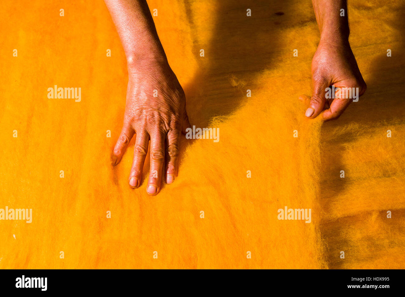 Hands of a woman are producing a big layer of felt Stock Photo - Alamy