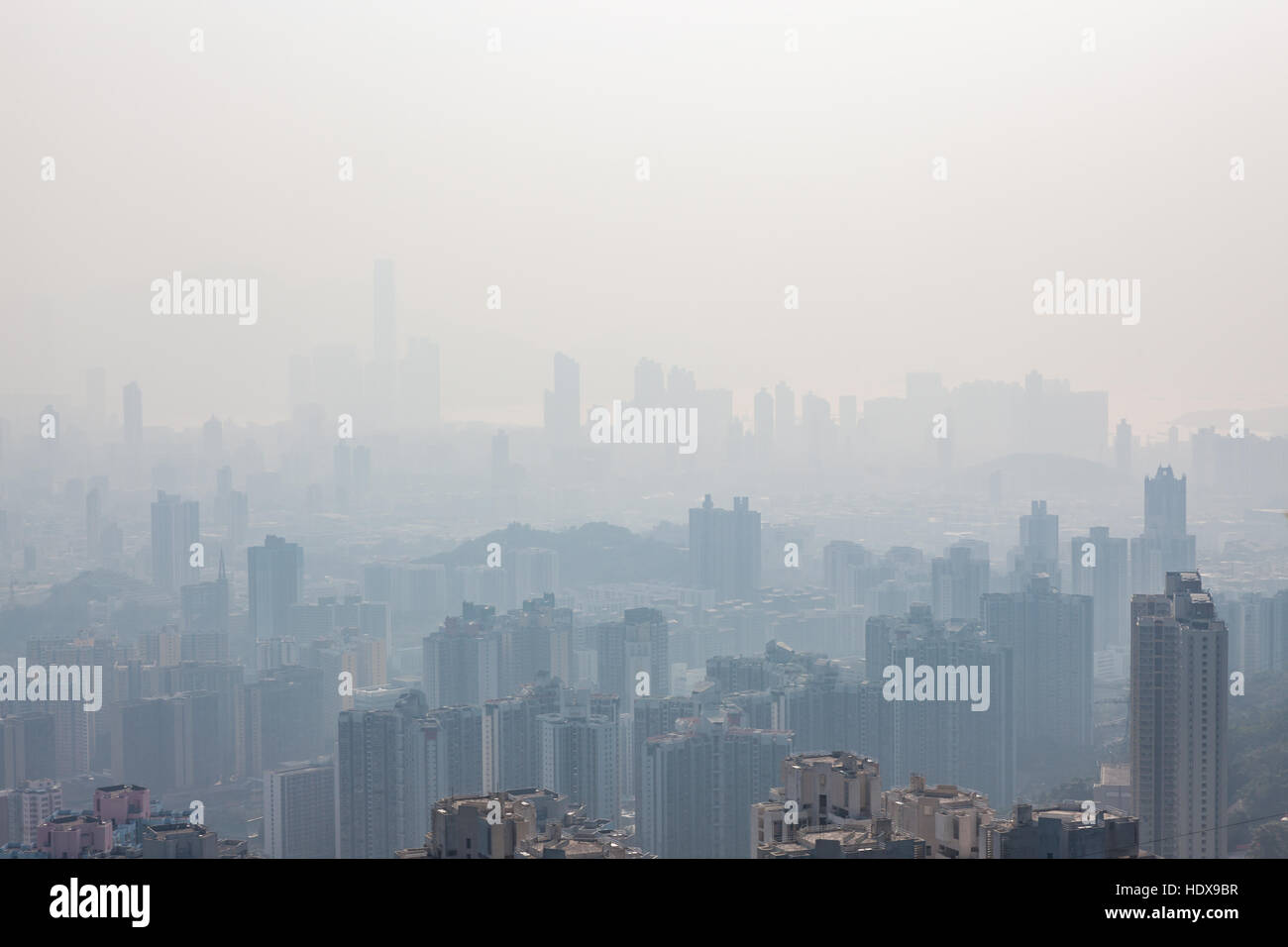 Hong kong tall buildings in haze Stock Photo - Alamy