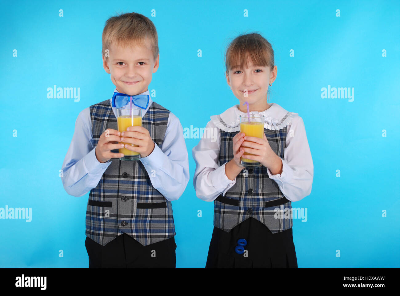 School boy and girl drink juice hi-res stock photography and images - Alamy