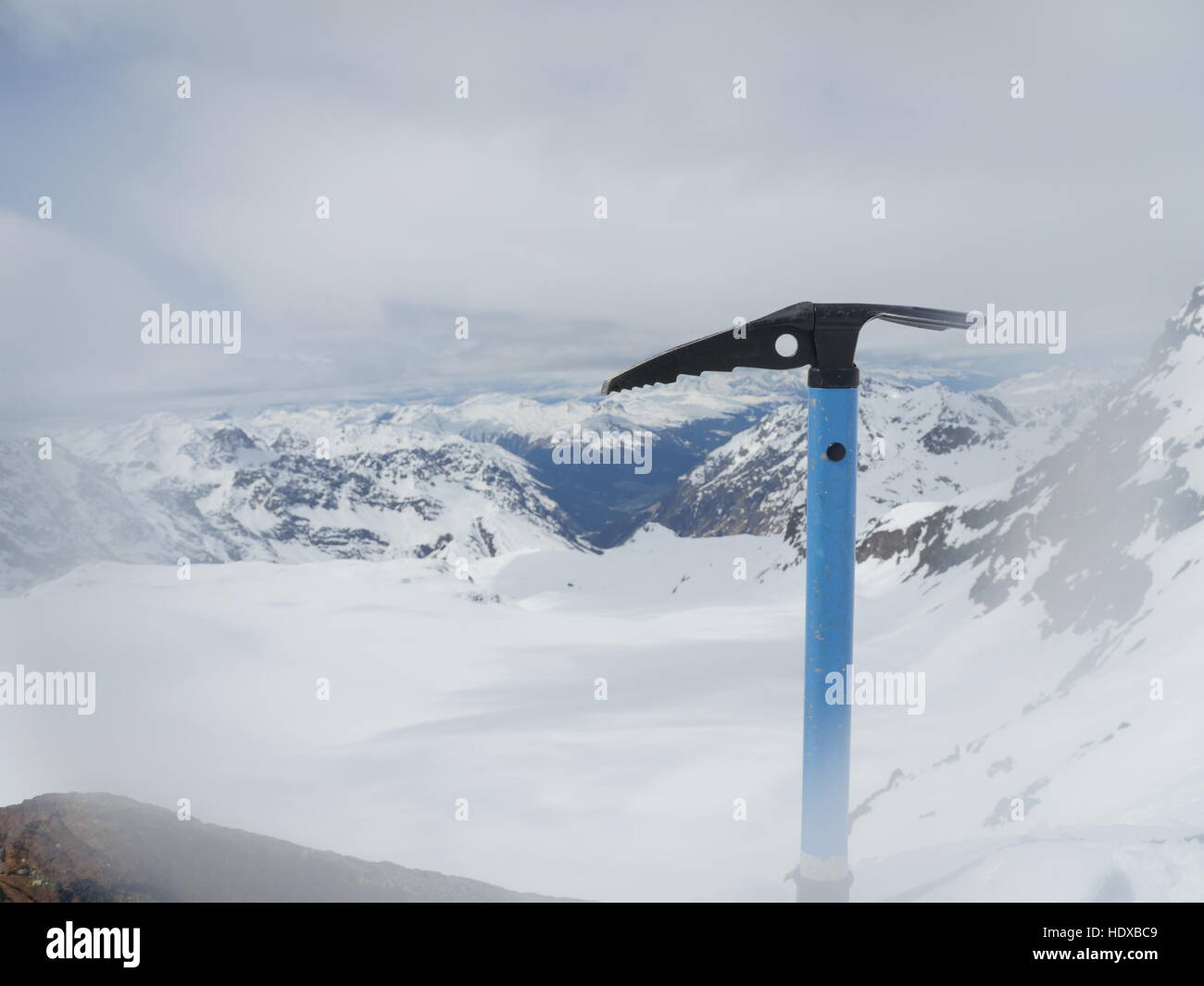 Ice axe in snow Stock Photo - Alamy