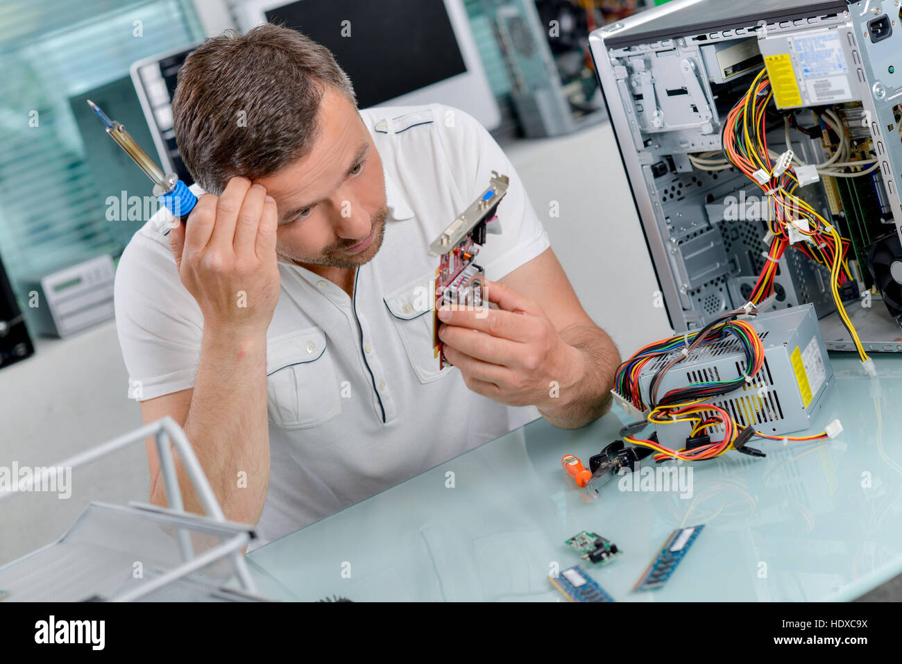 Man repairing a PC Stock Photo - Alamy