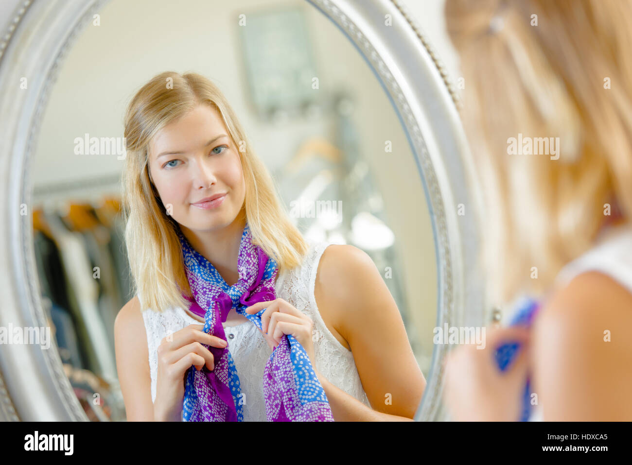 woman looking at the mirror Stock Photo - Alamy