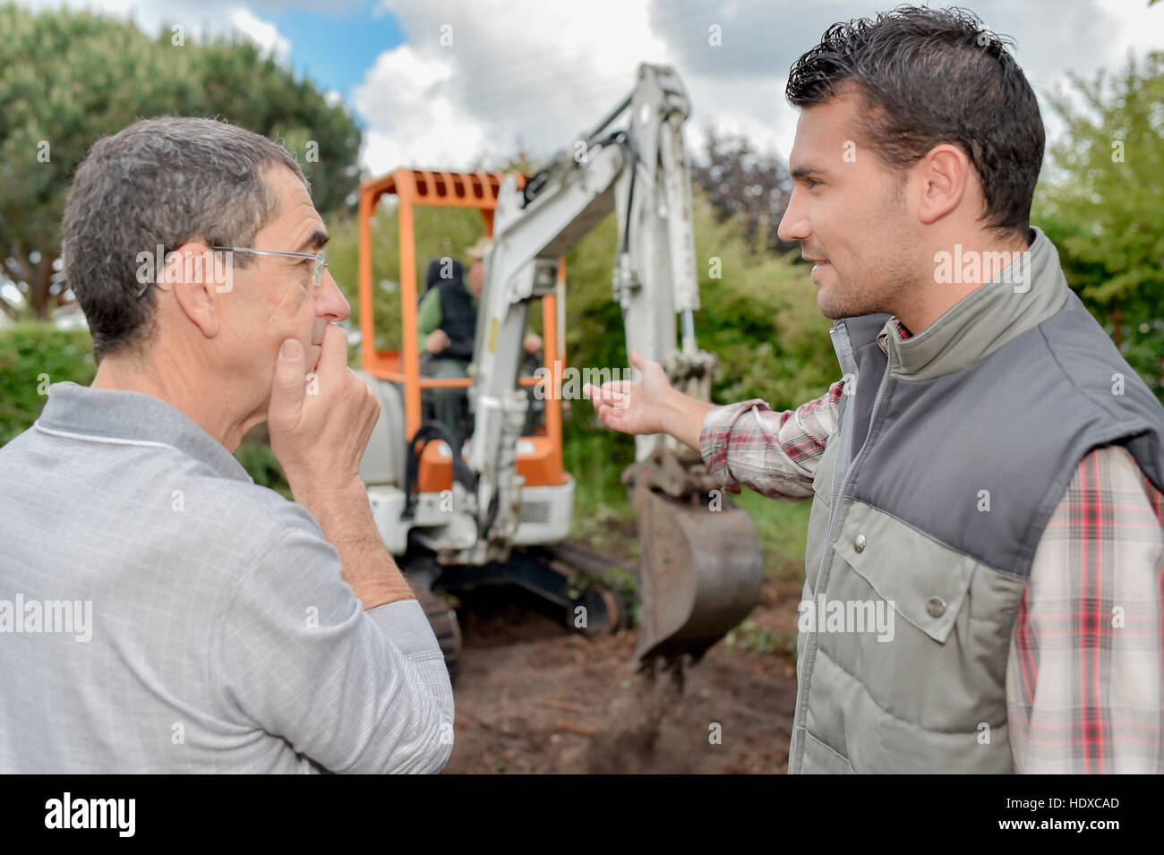 men landscaping a garden Stock Photo - Alamy