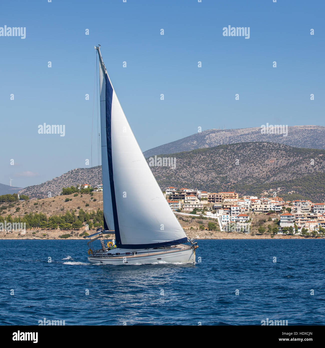 Sailing boat. Yachting in the wind through the waves at the Sea Stock ...