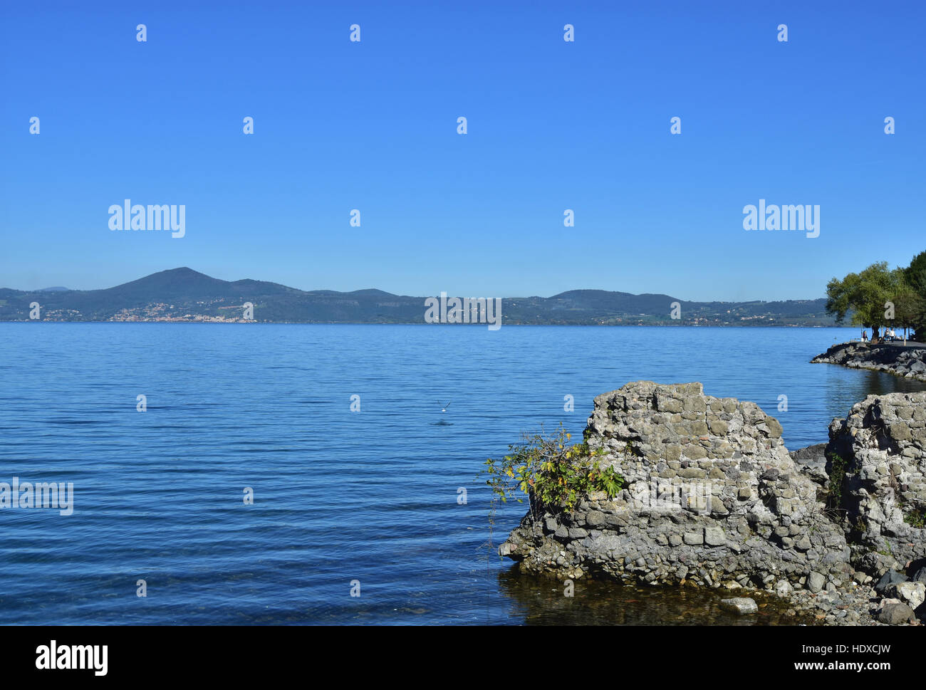 Lake Bracciano viewed from Anguillara Sabazia waterfront with ancient ...