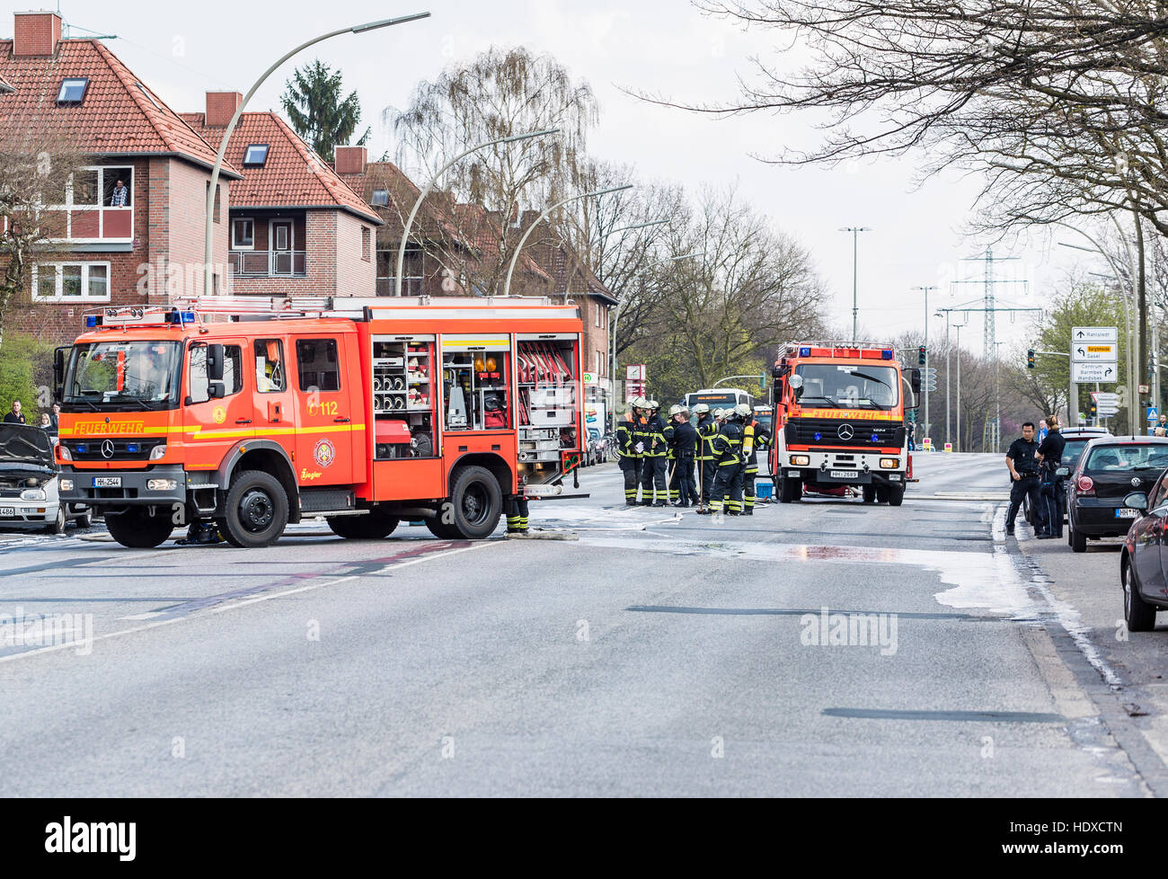 Fire Brigade extinguish burning car Stock Photo - Alamy