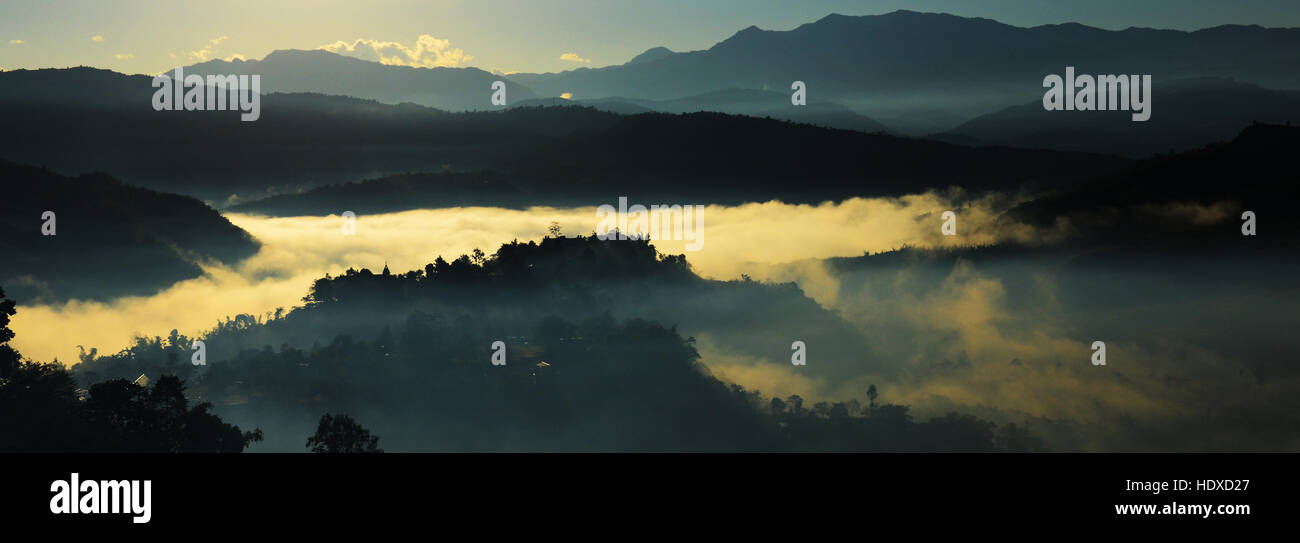 A beautiful misty morning between the mountains of Mon district in ...