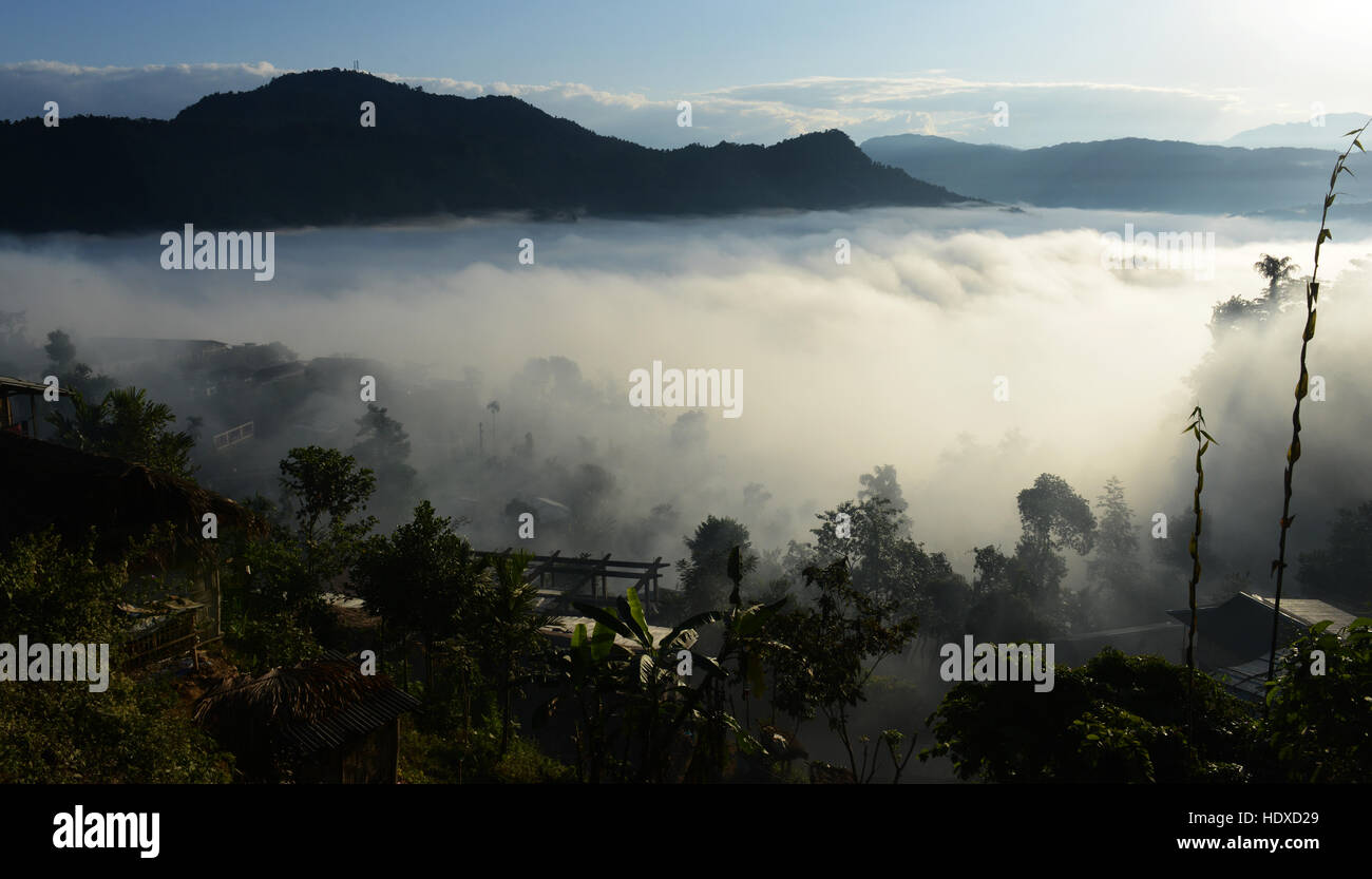 A beautiful misty morning between the mountains of Mon district in ...