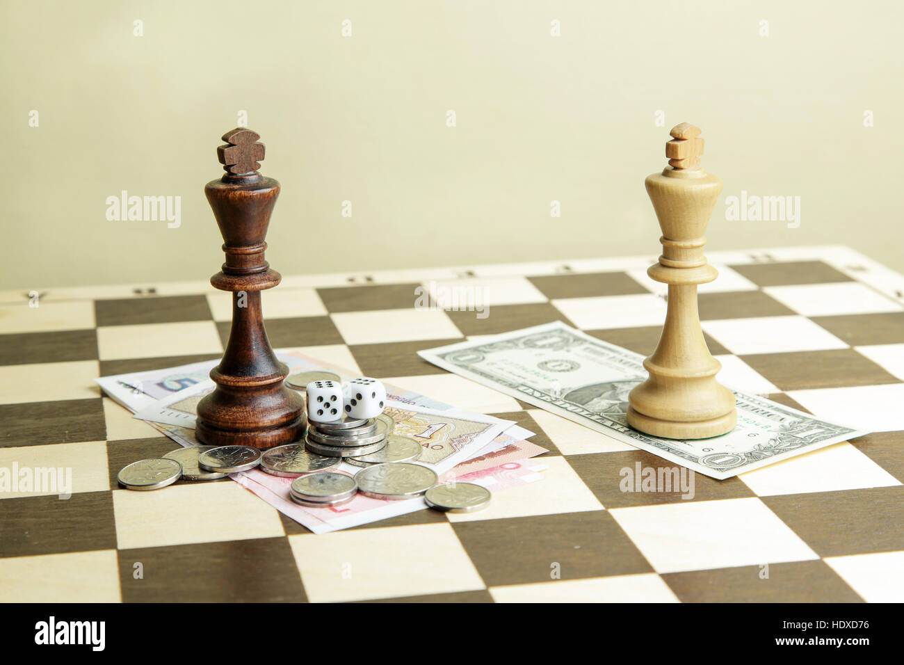 Chessmen, money and dice on a chessboard Stock Photo - Alamy