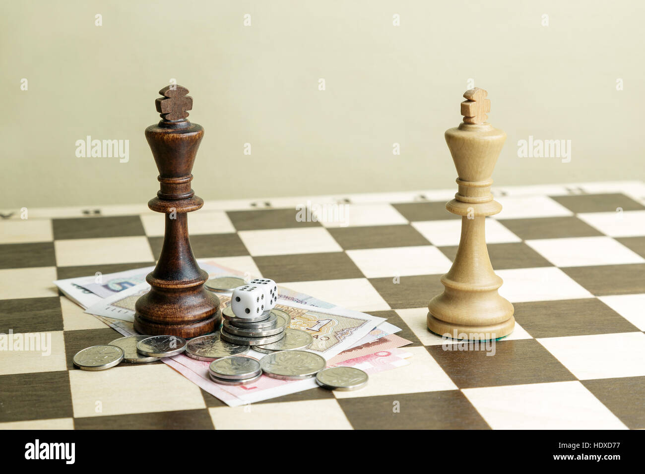 Chessmen, money and dice on a chessboard Stock Photo - Alamy