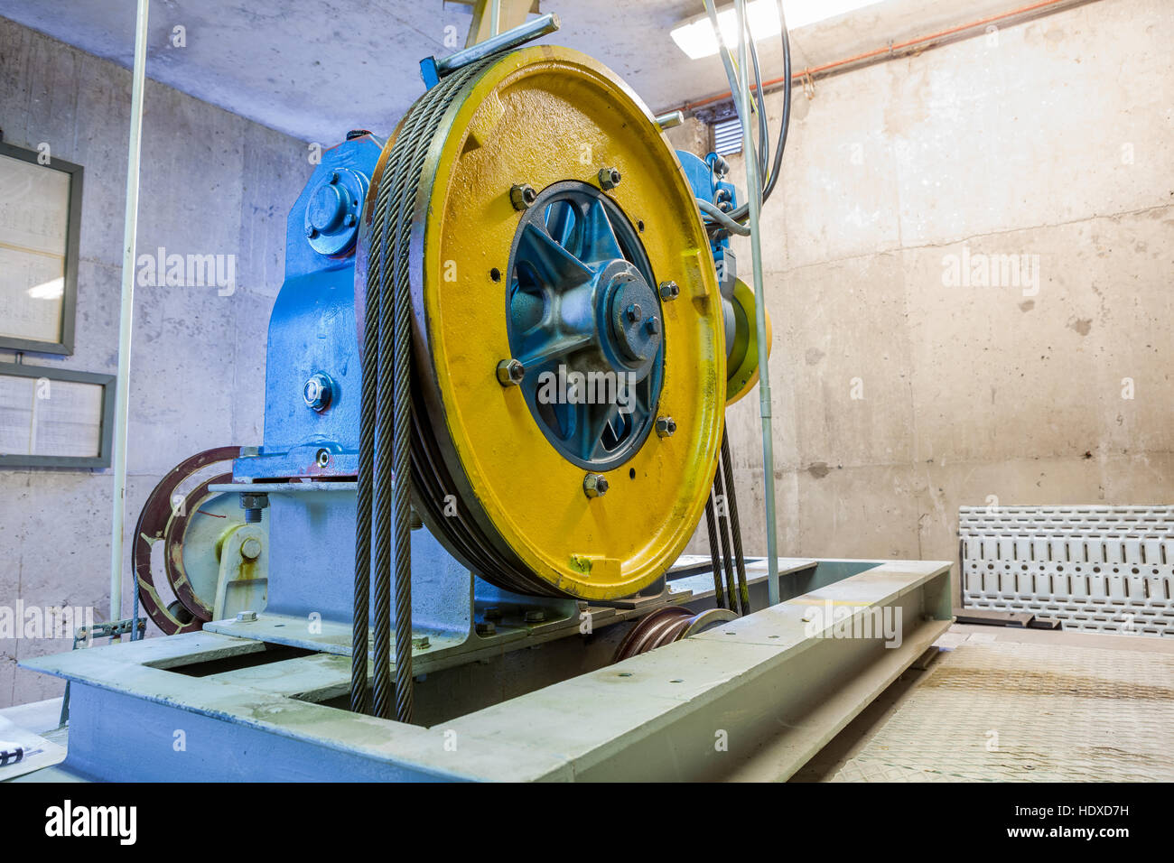 iron cables on a wheel of a motor of the elevator Stock Photo - Alamy
