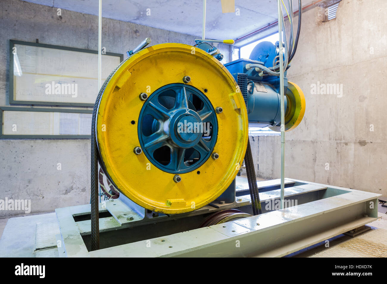 iron cables on a wheel of a motor of the elevator Stock Photo - Alamy