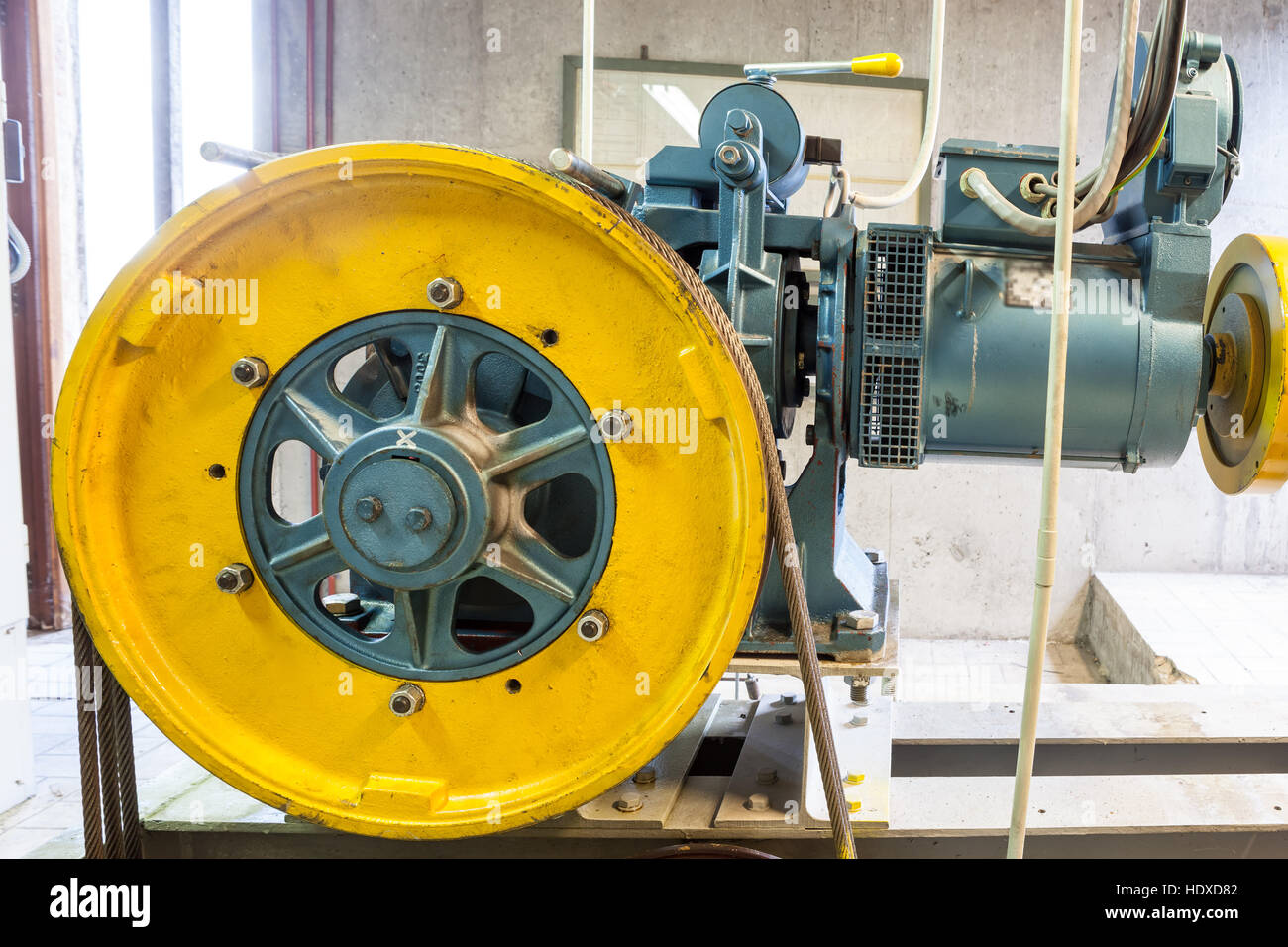iron cables on a wheel of a motor of the elevator Stock Photo - Alamy