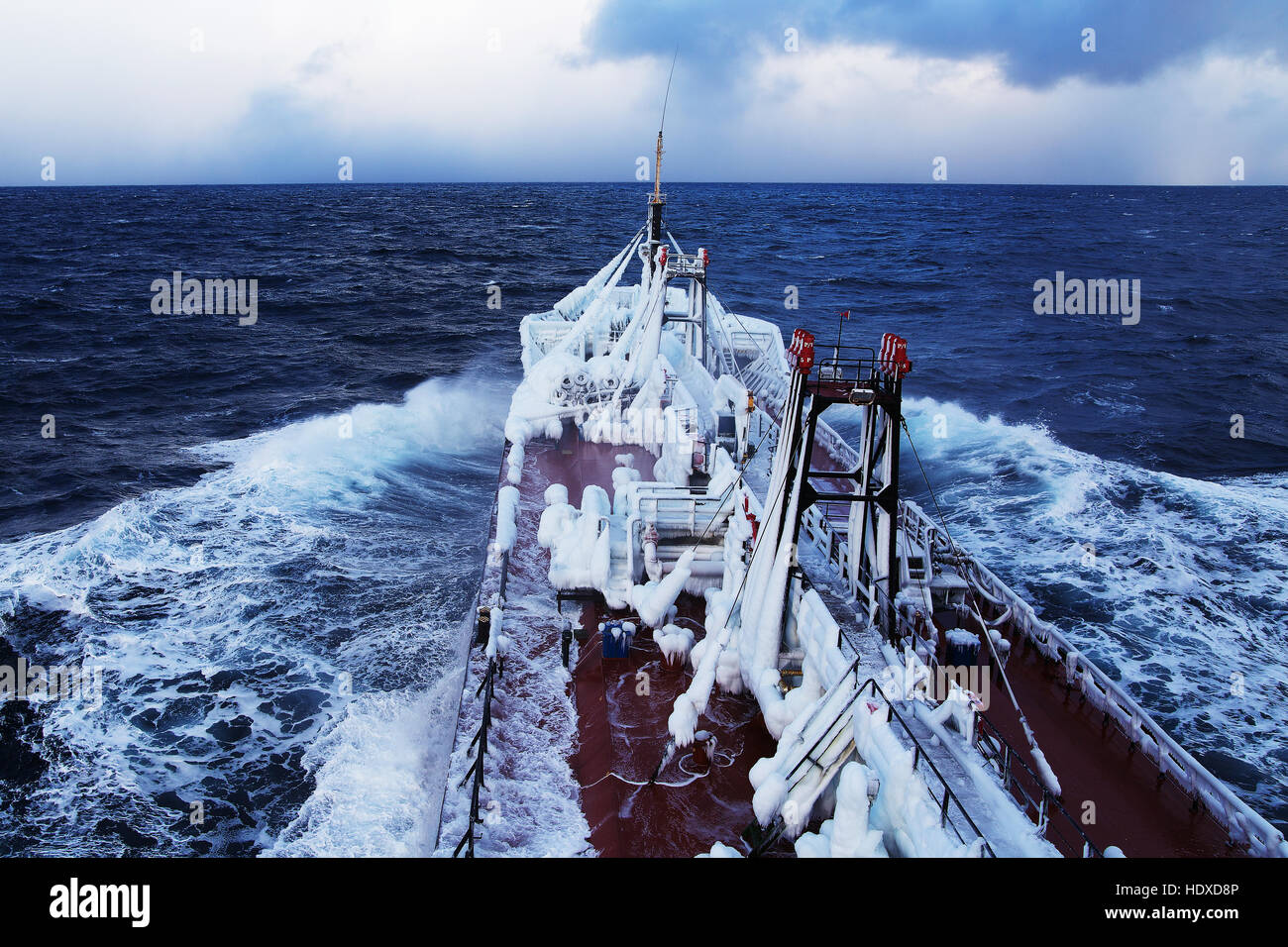 The deck of the vessel covered with ice, in the sea, following in storm ...