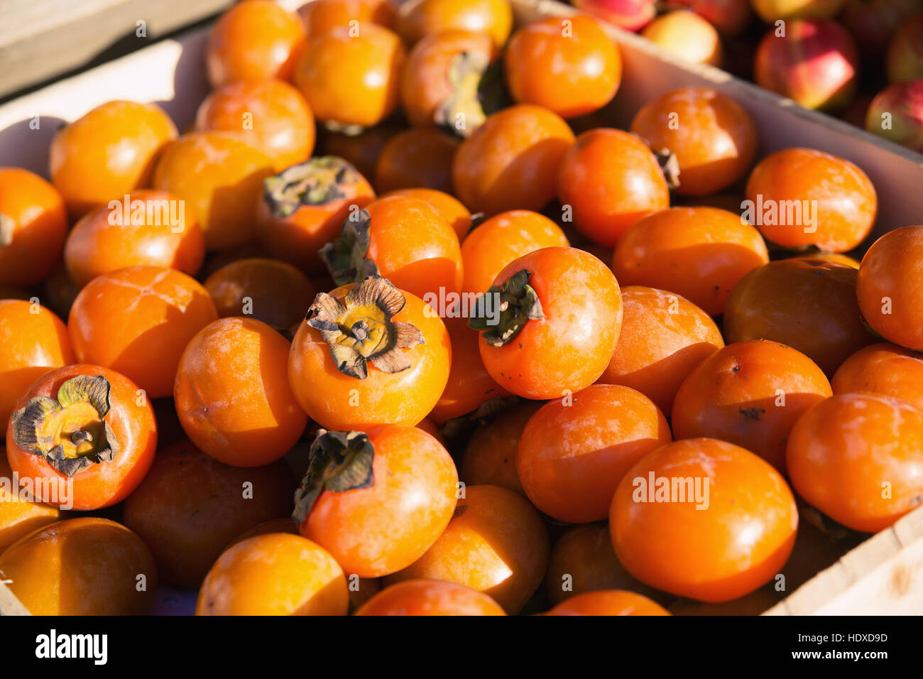 Tray with ripe fruits of a persimmon Stock Photo - Alamy