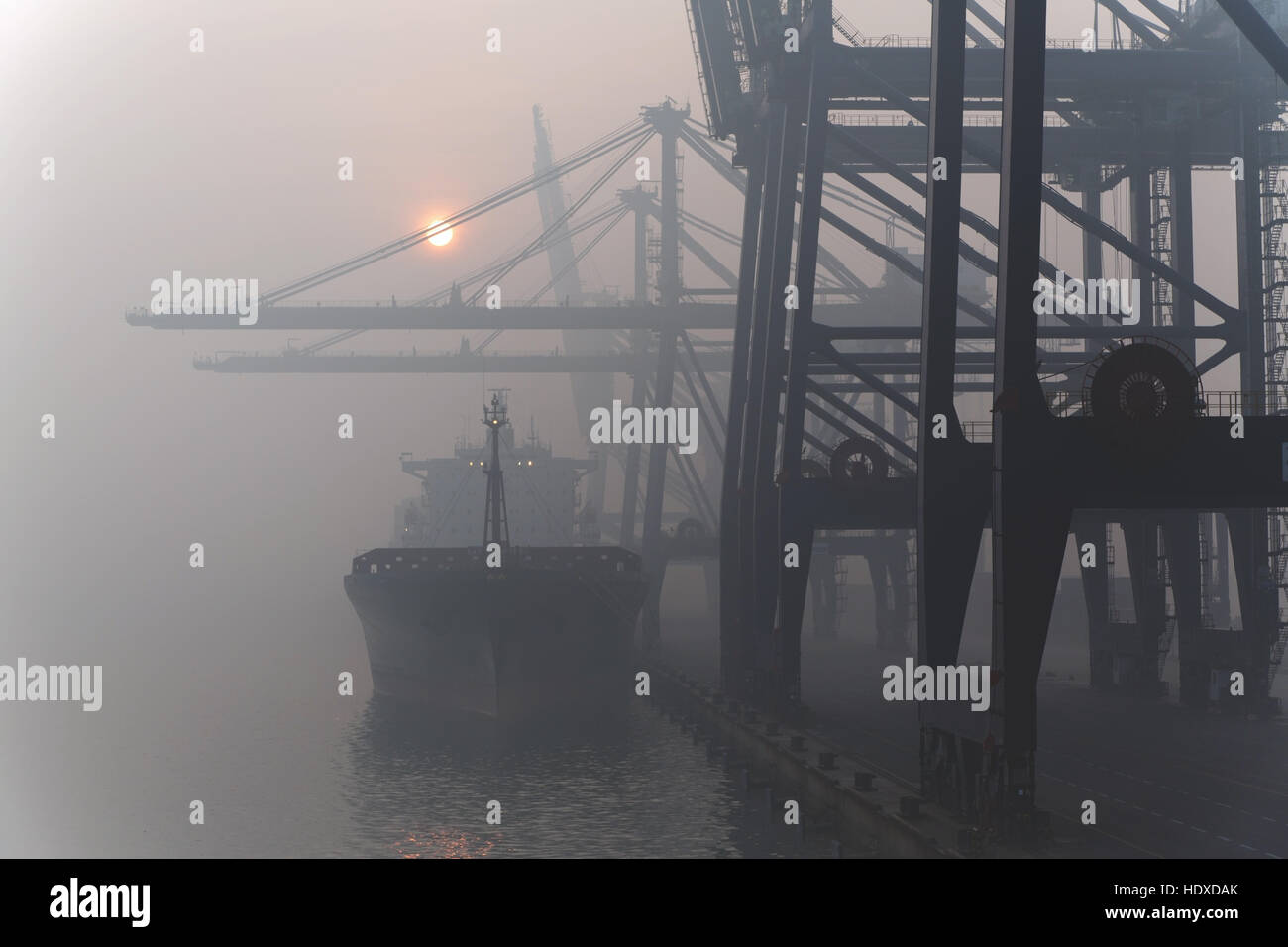 Ship at the pier in the morning mist during loading Stock Photo - Alamy