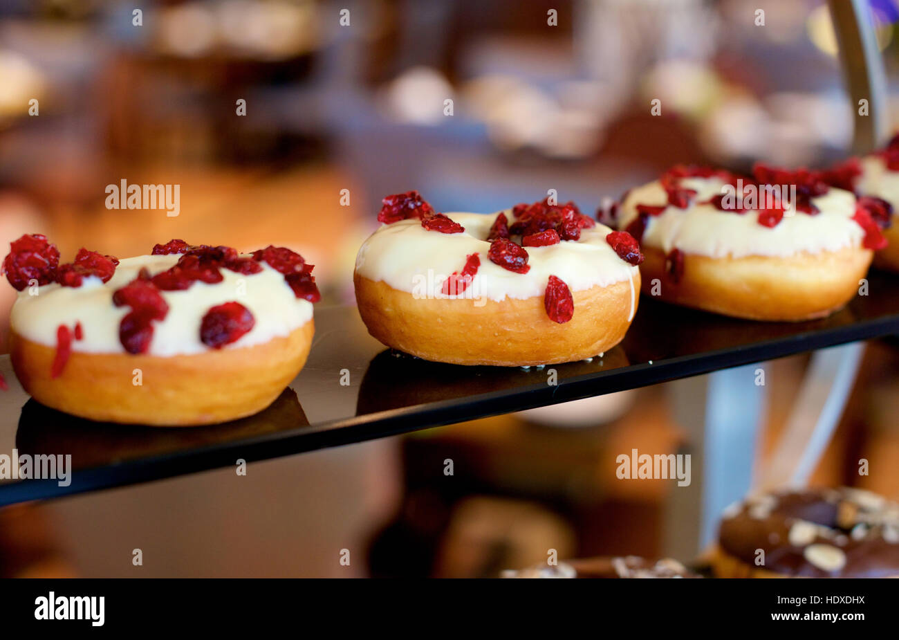 Chocolate Grapes Donuts in restaurant store Stock Photo - Alamy