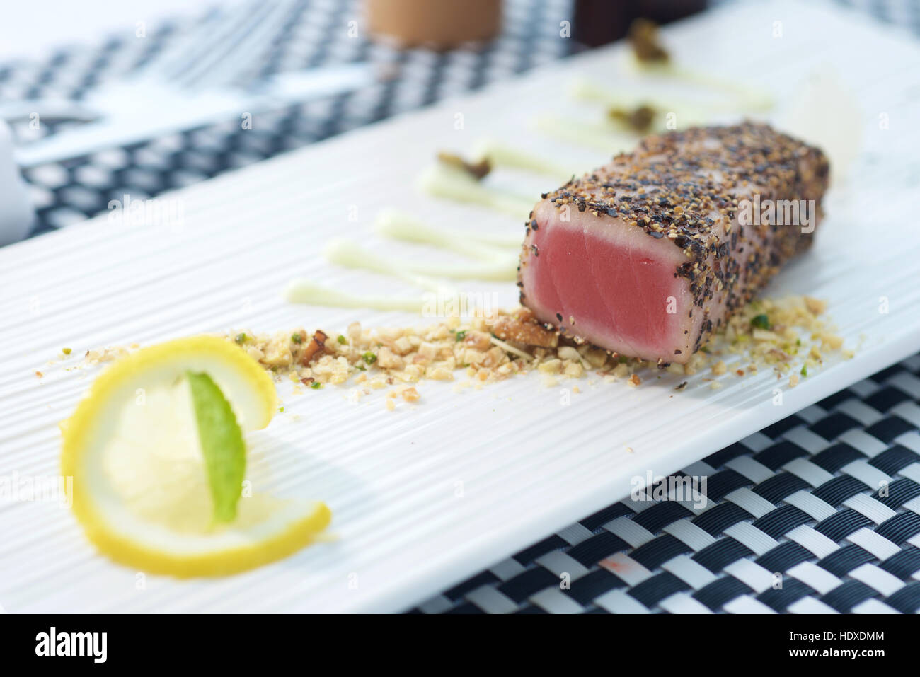 Fresh Tuna Dish on white plate Stock Photo - Alamy