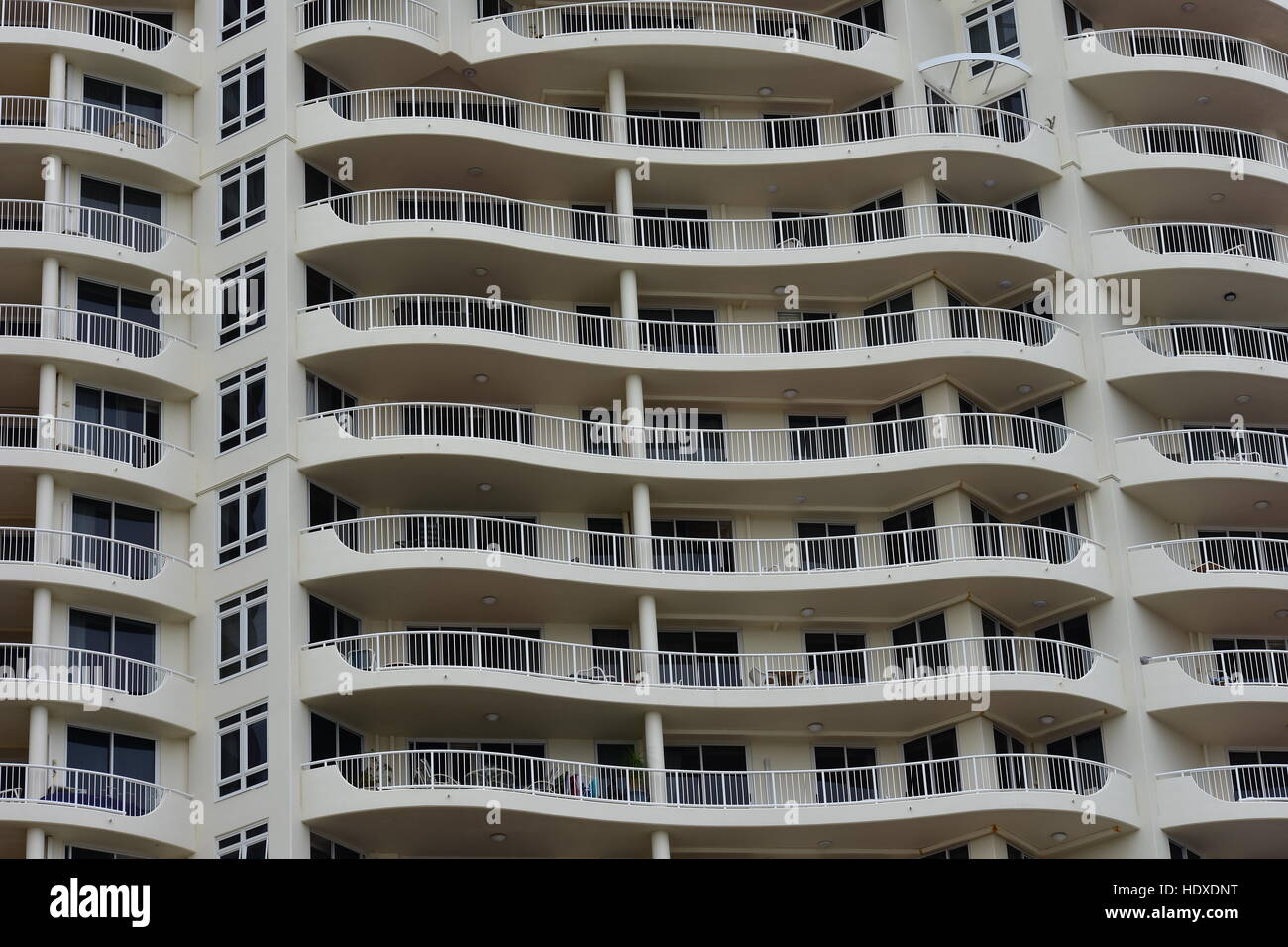 Front exterior wall of multi-story apartment building with curved ...