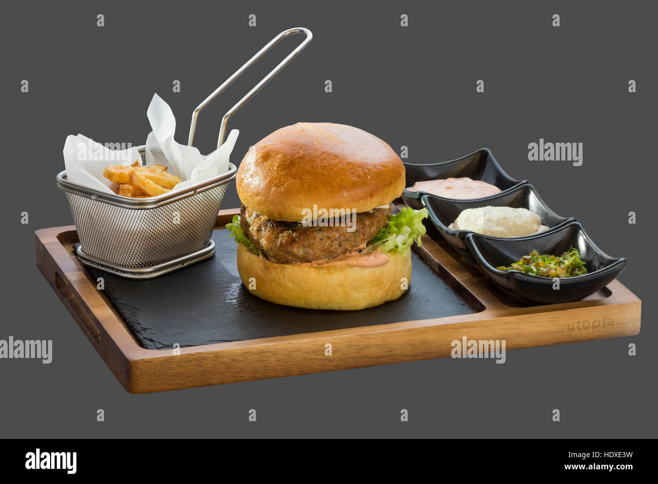 burger patty and garnish with fried potatoes and three kinds of sauce ...