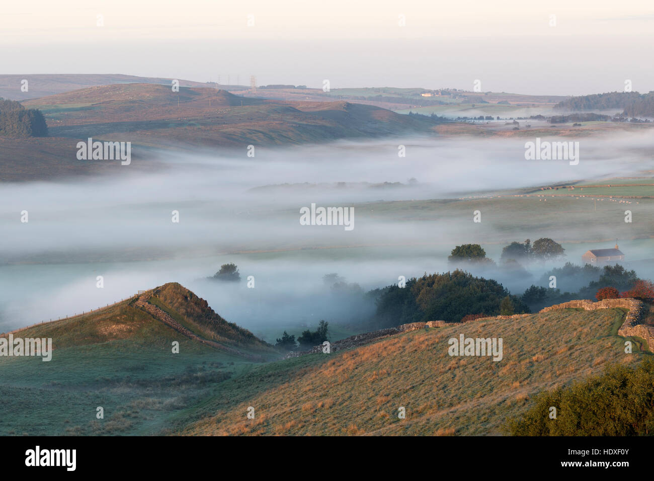 Low-lying mist at dawn obscures Cawfield Quarry and Haltwhistle Common ...