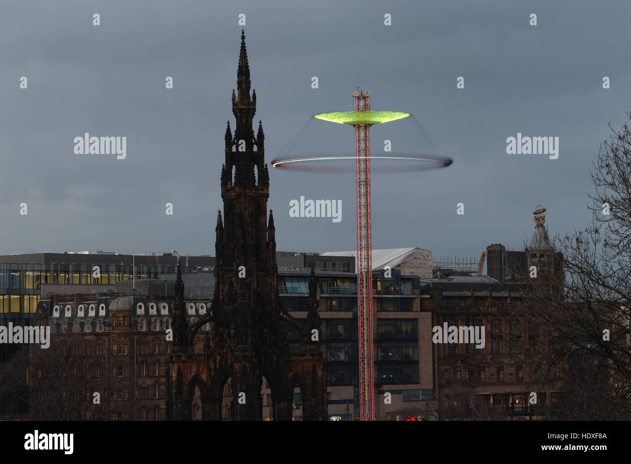 Star Flyer ride and Scott Monument at dusk Edinburgh Scotland December ...