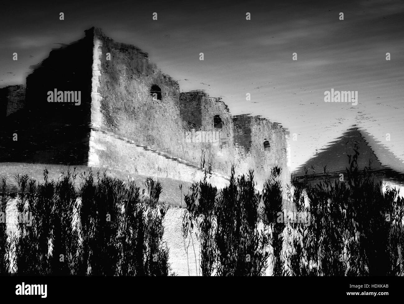 reflection of the Fagaras fortress, Romania, in the water of the ...