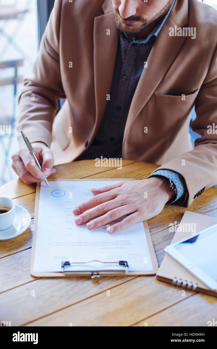 Man sitting in coffee shop hi-res stock photography and images - Alamy