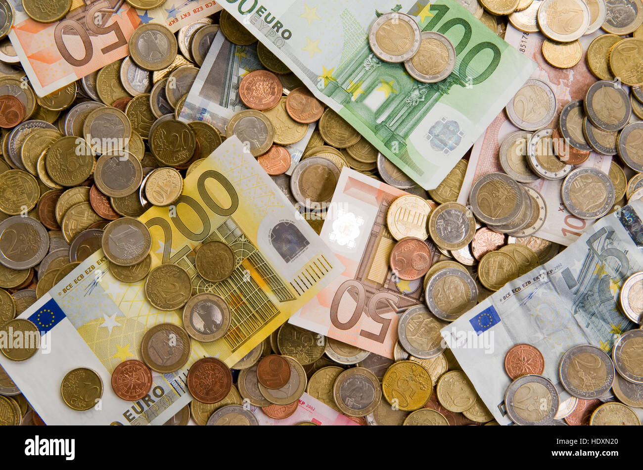 Euro banknotes and coins Stock Photo - Alamy