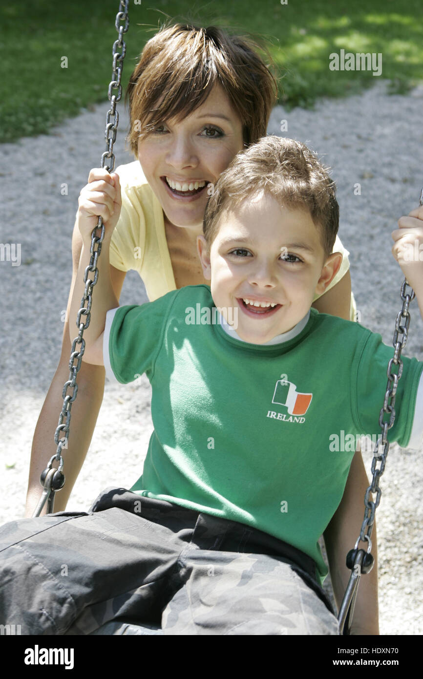 Young mother and son, child in playground Stock Photo - Alamy