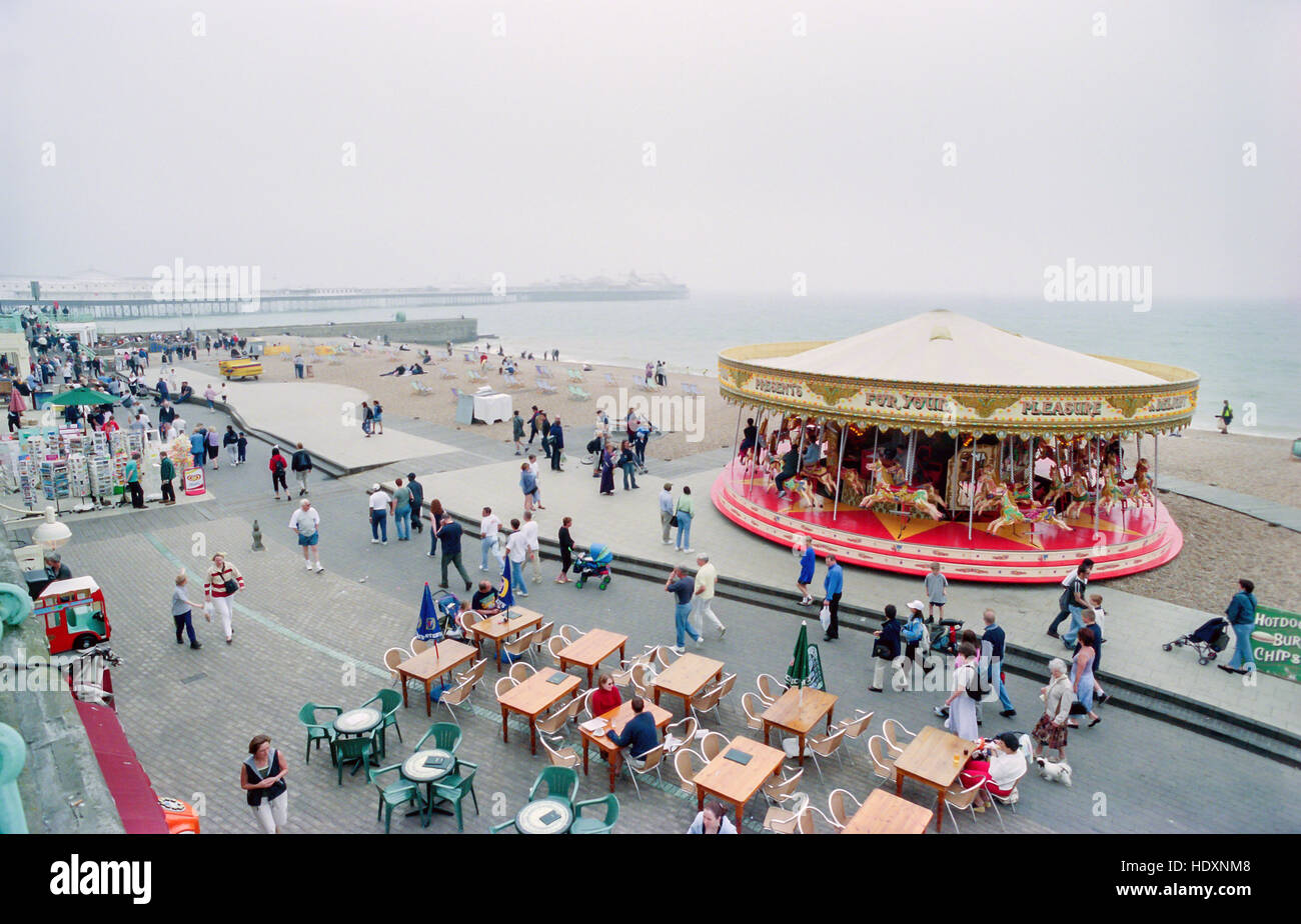Families enjoying a day out on Brighton beach Stock Photo - Alamy