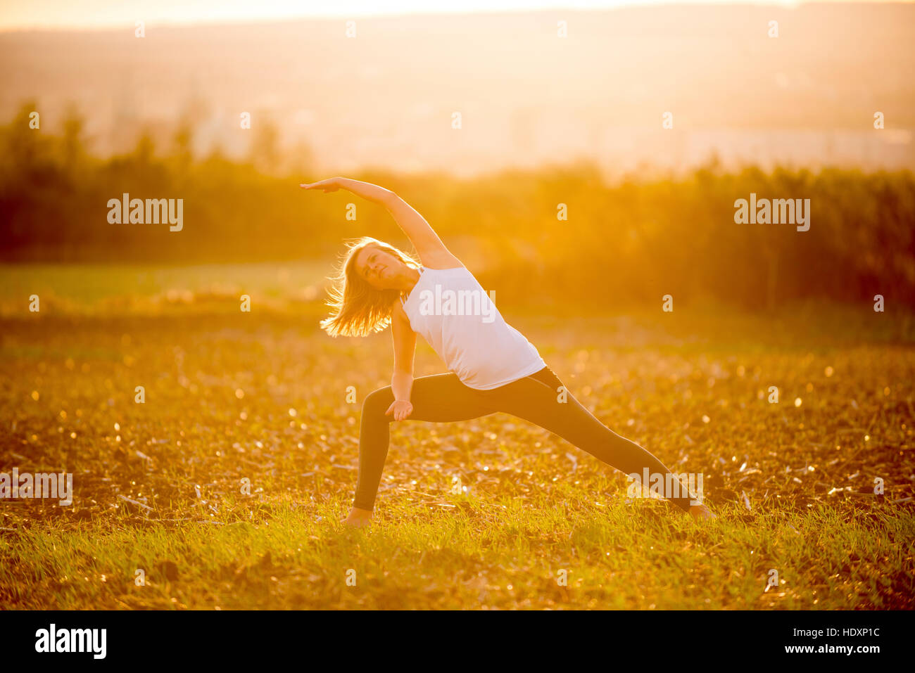 Woman doing yoga exercises Stock Photo - Alamy