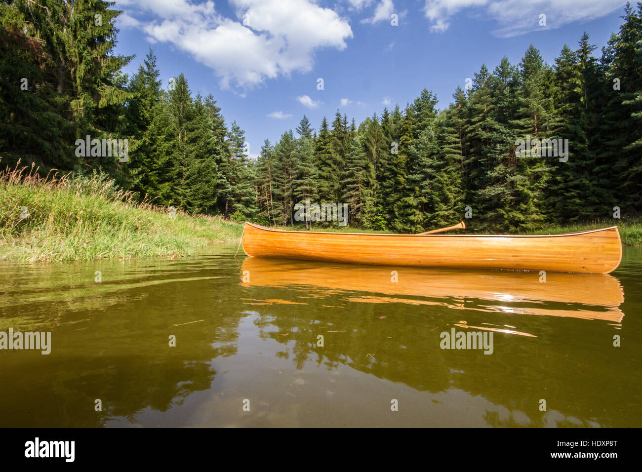 Canoe in the lake on a beautiful hot summer day Stock Photo - Alamy